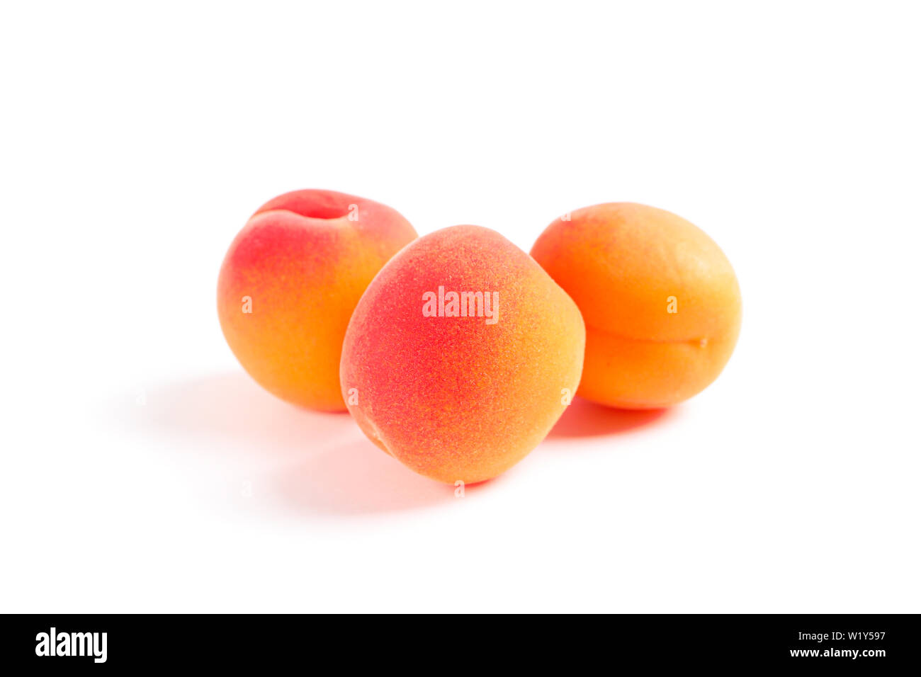 Fresh sweet apricots isolated on white background Stock Photo - Alamy
