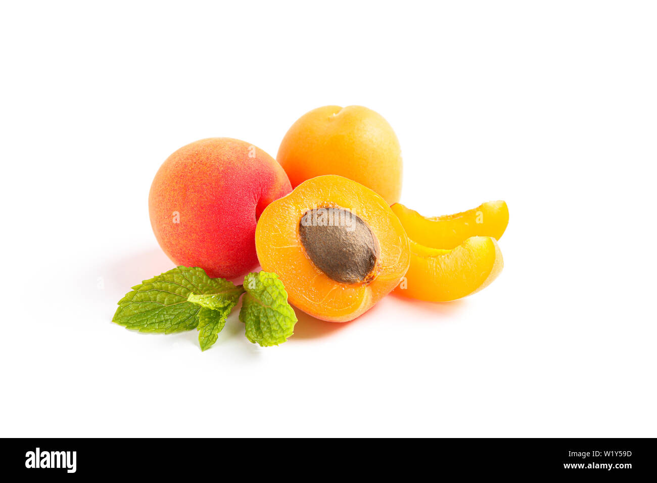 Apricots with mint isolated on white background Stock Photo - Alamy