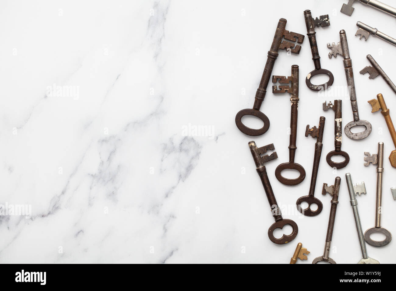 Vintage old fashioned keys on a marble background with copy space Stock ...