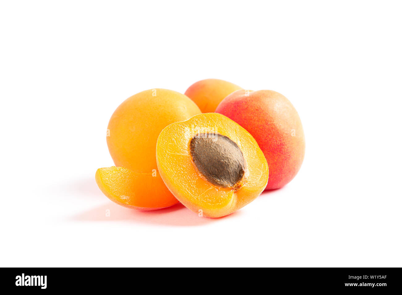 Fresh sweet apricots isolated on white background Stock Photo - Alamy