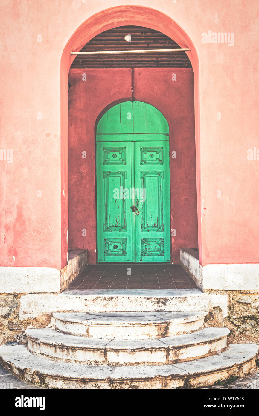 Detail of wooden door and stair steps in an old orange house. Vintage ...