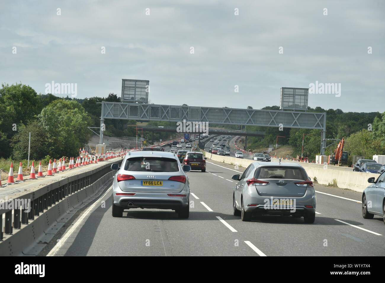 Motorway traffic and signage gantry Stock Photo - Alamy