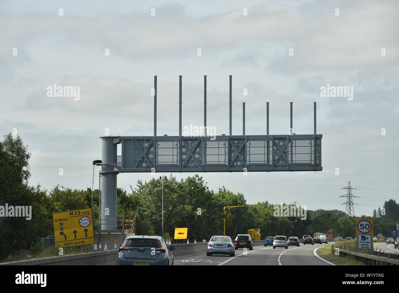 Motorway traffic and signage gantry Stock Photo - Alamy