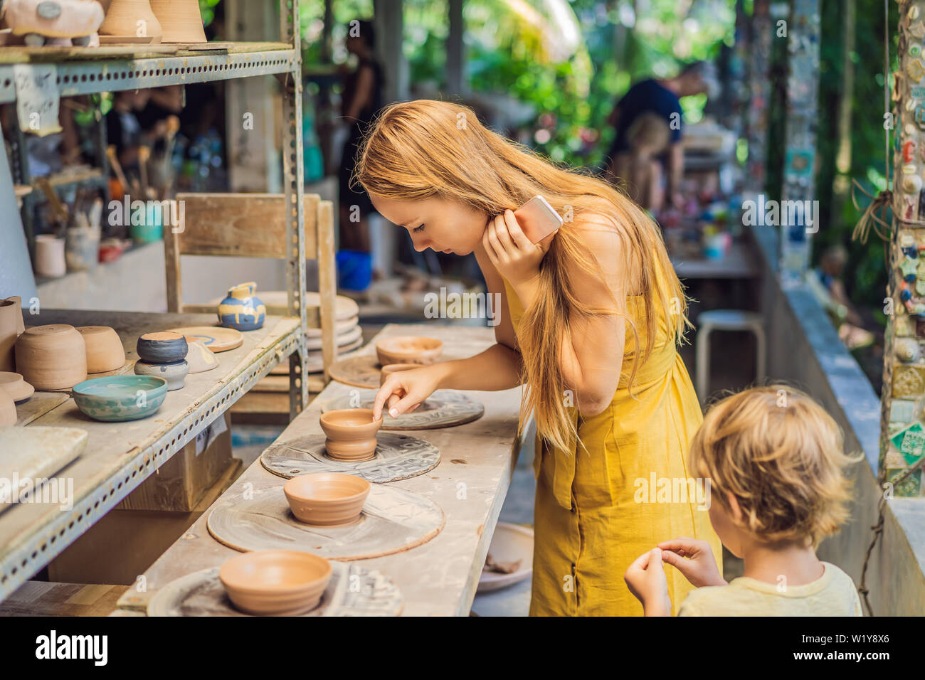 mother and son doing ceramic pot in pottery workshop Stock Photo - Alamy