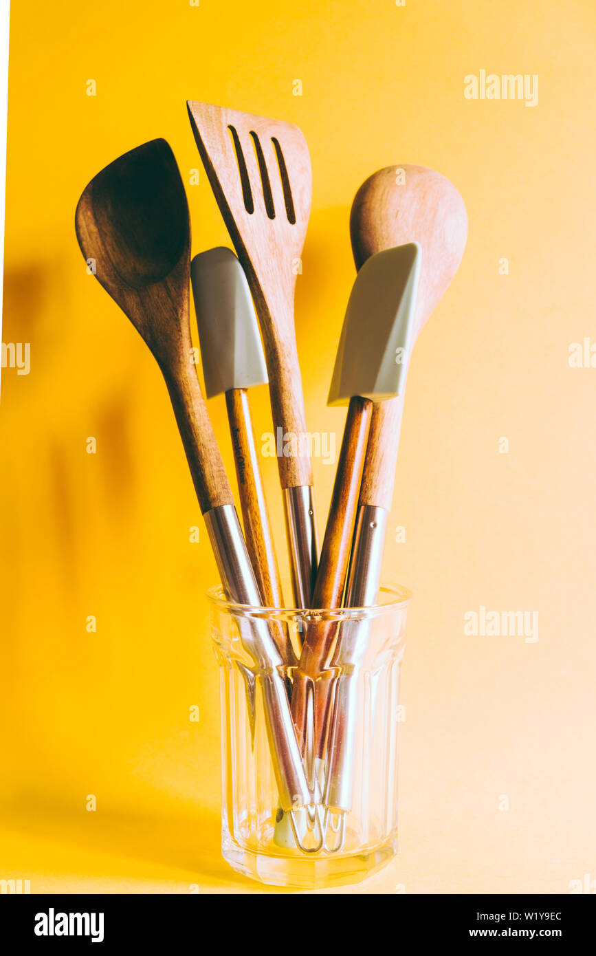 Kitchen foody background, utensil and a white oven container on a brown ...