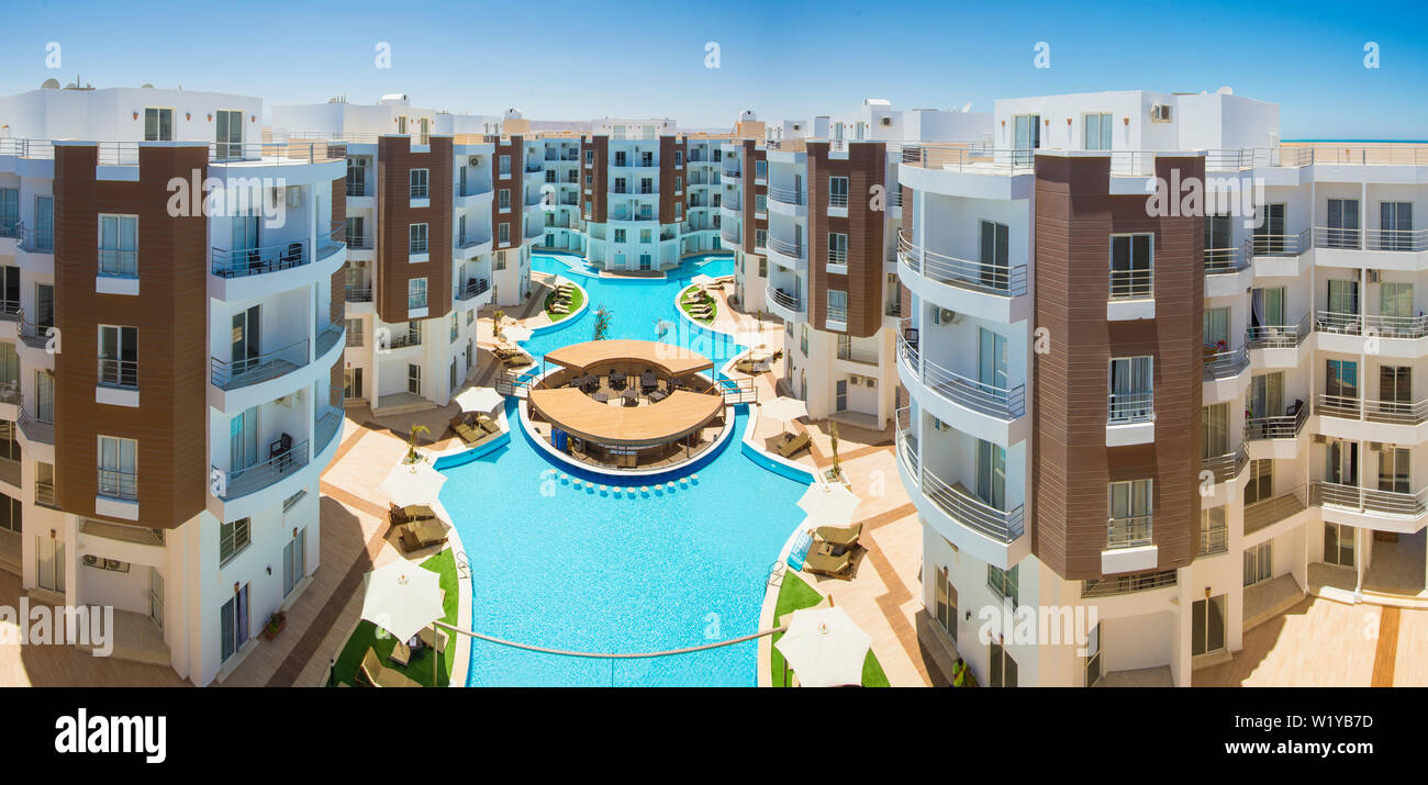 Panoramic aerial view of large swimming pool with bar at a luxury ...