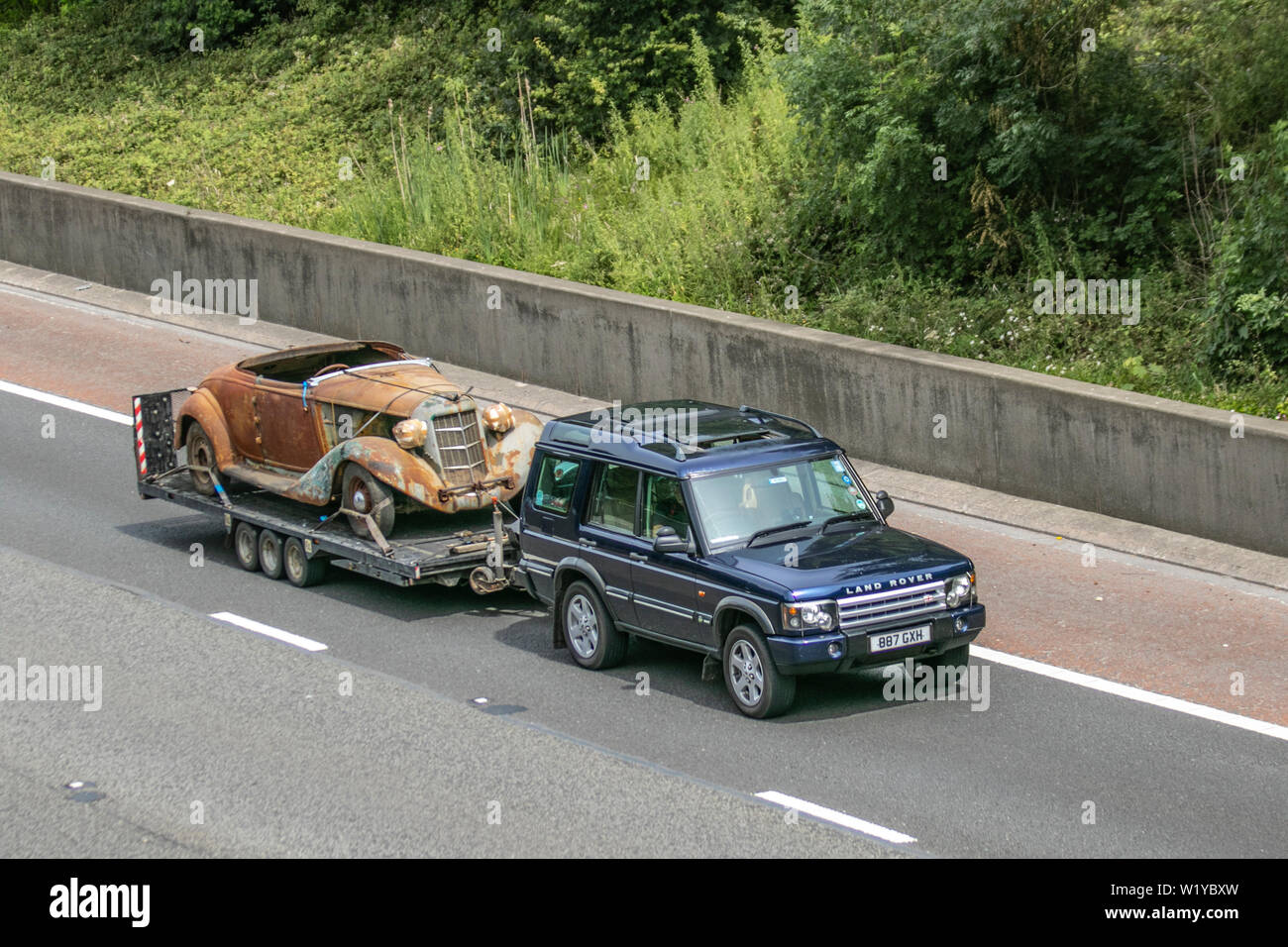 Rusty corroded two-seater sports car wreck, 1950s-era automobiles 1930 ...