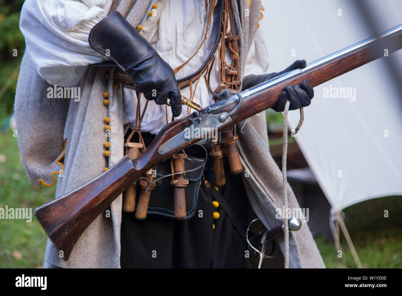 Musketeer preparing to fire muskets Stock Photo - Alamy