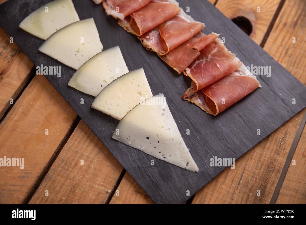 Serrano cheese and ham table from Spain Stock Photo - Alamy