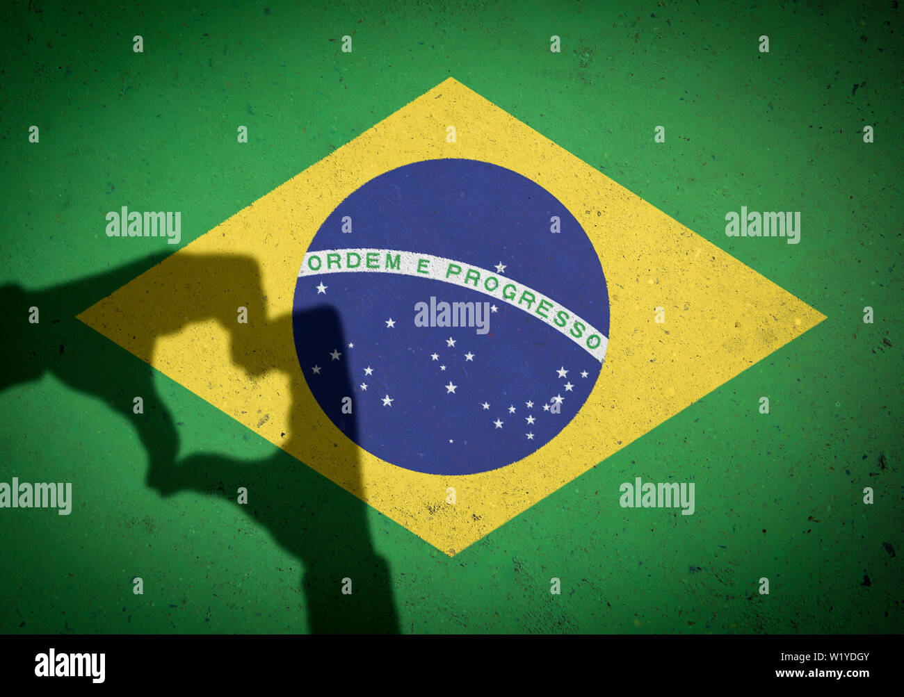 Shadow of patriotic hands making heart shape in front of a Brazilian ...