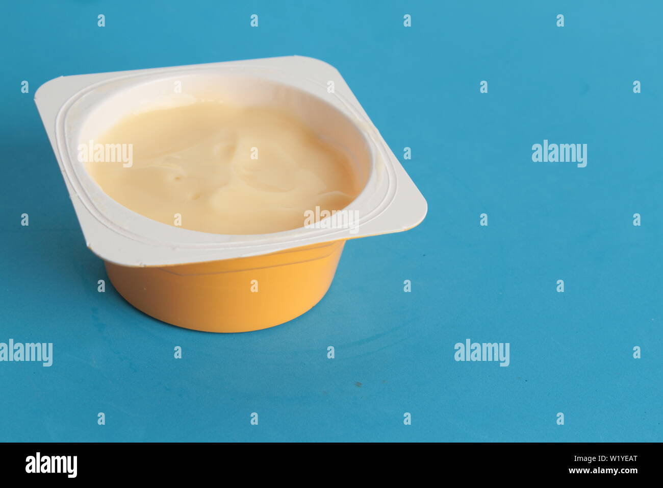 custard packed in plastic container Stock Photo - Alamy