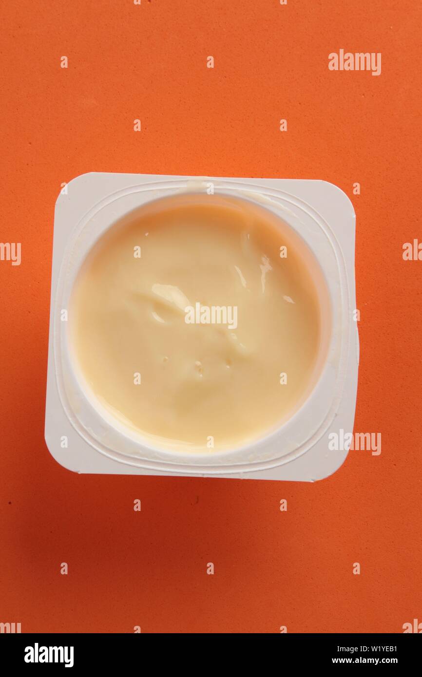 custard packed in plastic container Stock Photo - Alamy