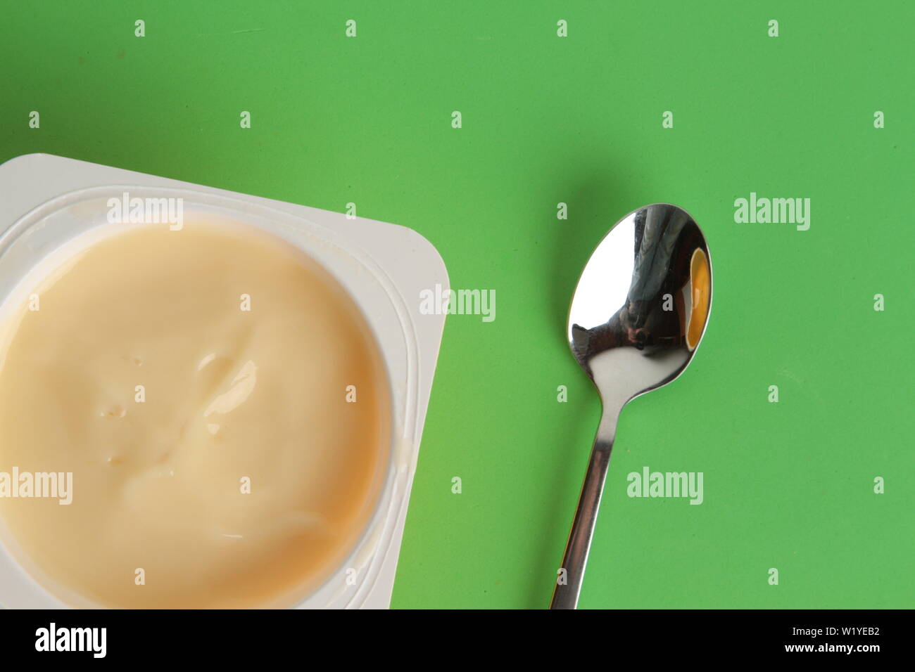 Vanilla custard in plastic container hi-res stock photography and ...