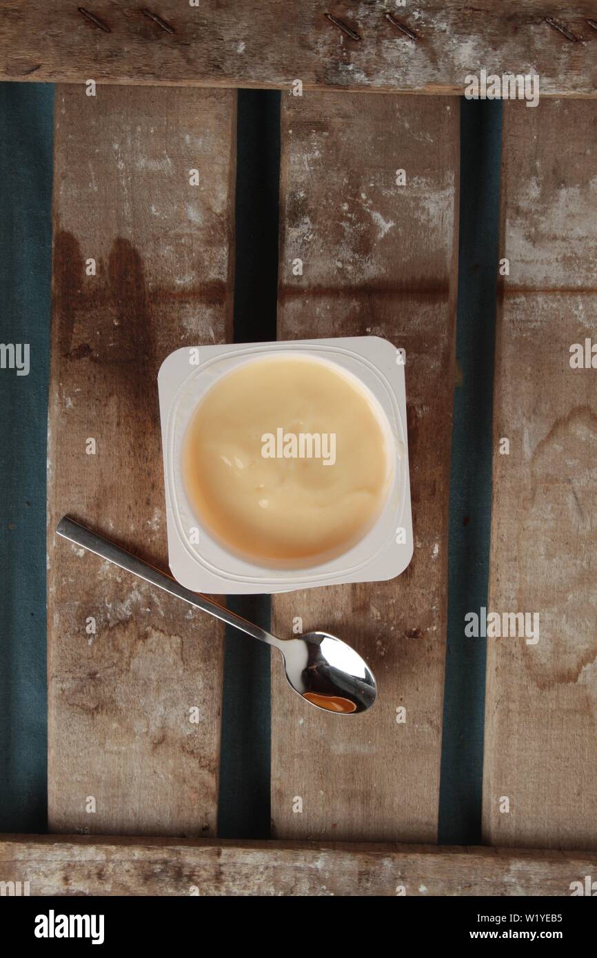 custard packed in plastic container Stock Photo - Alamy