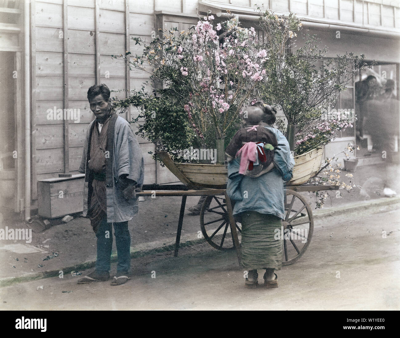 Woman carrying a child on her back hi-res stock photography and images ...