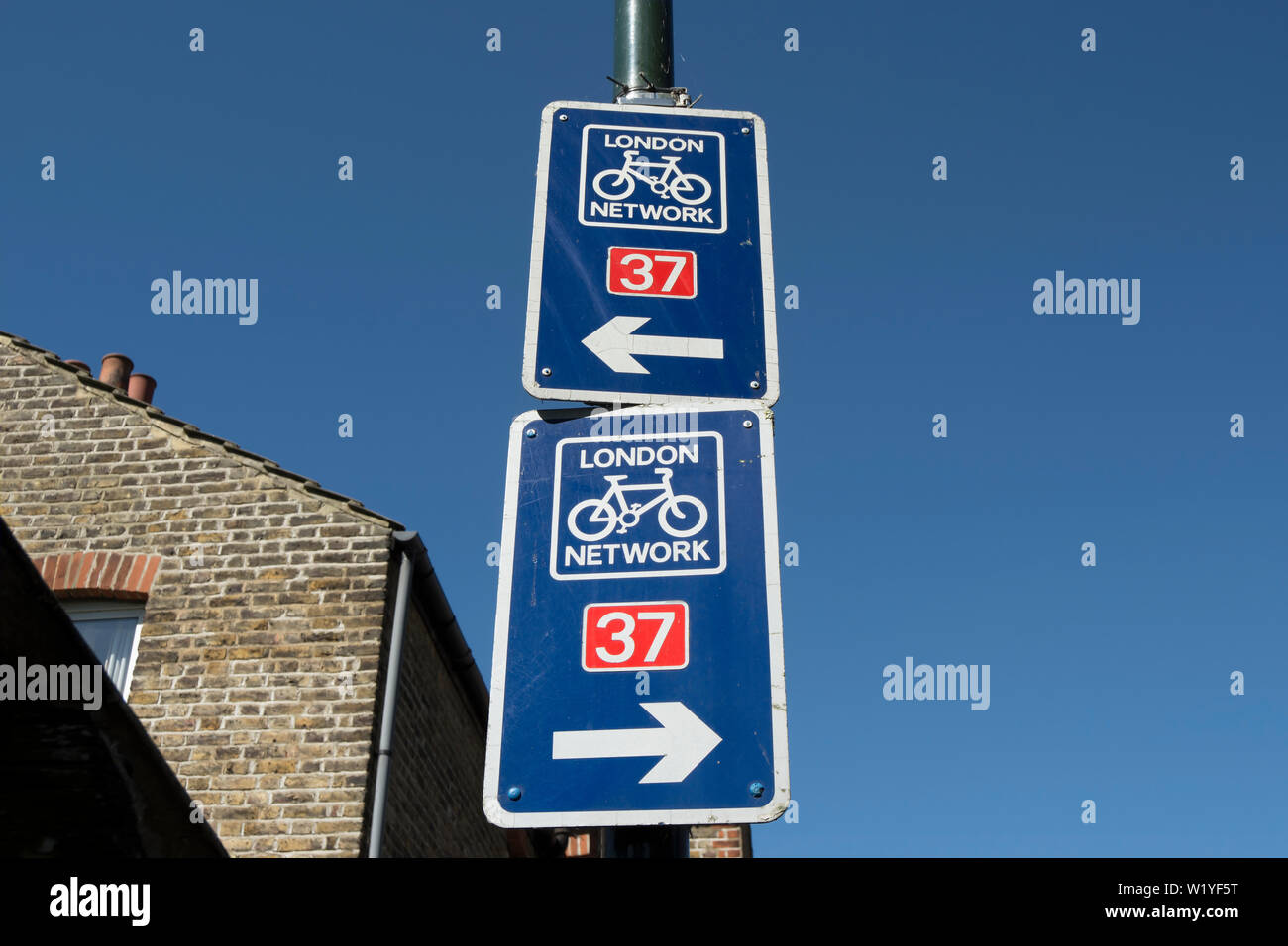 london cycle network route 37 signs pointing in opposite directions, in ...