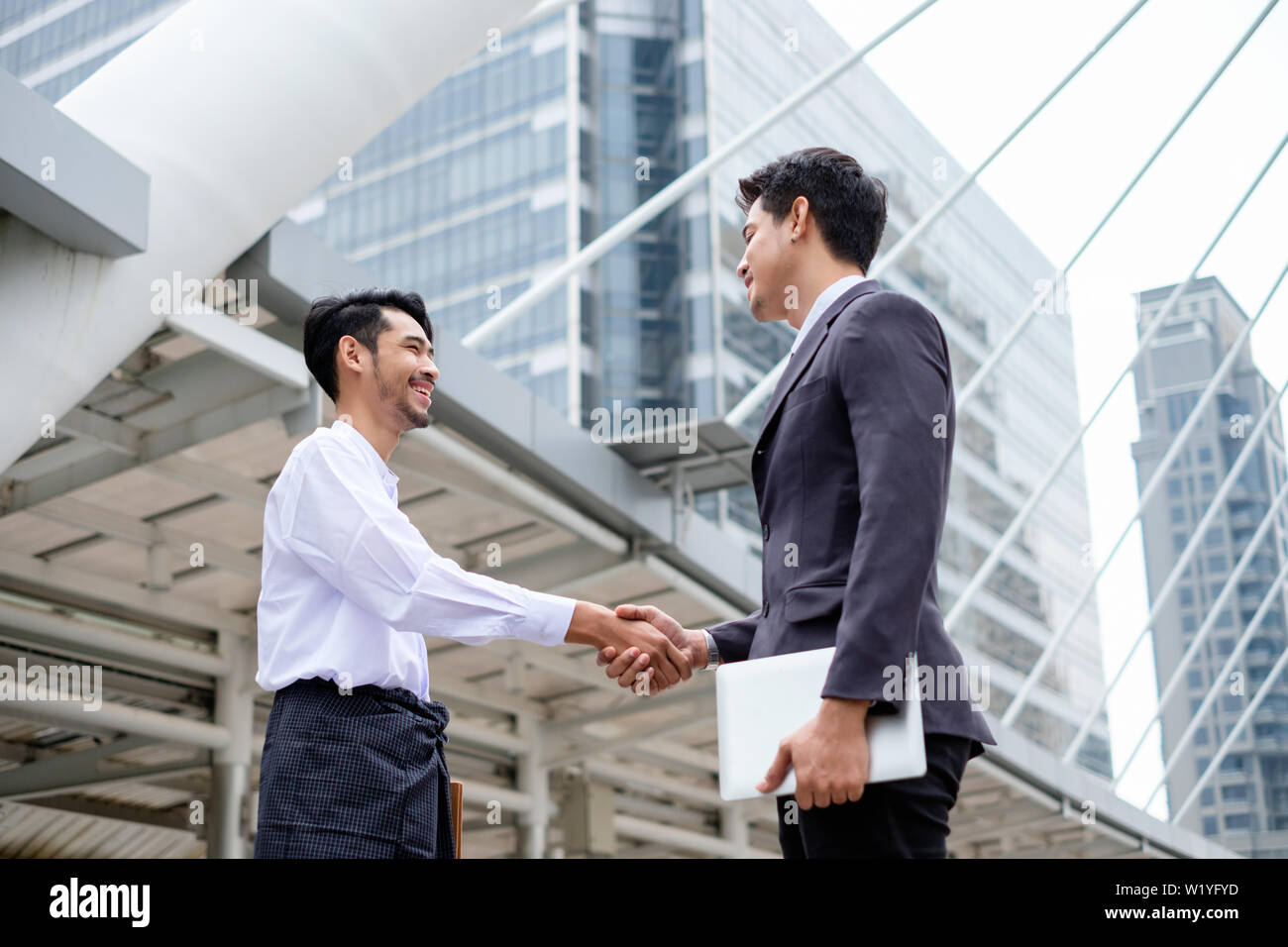 Handsome businessman partnership with handshake agreement of asean ...