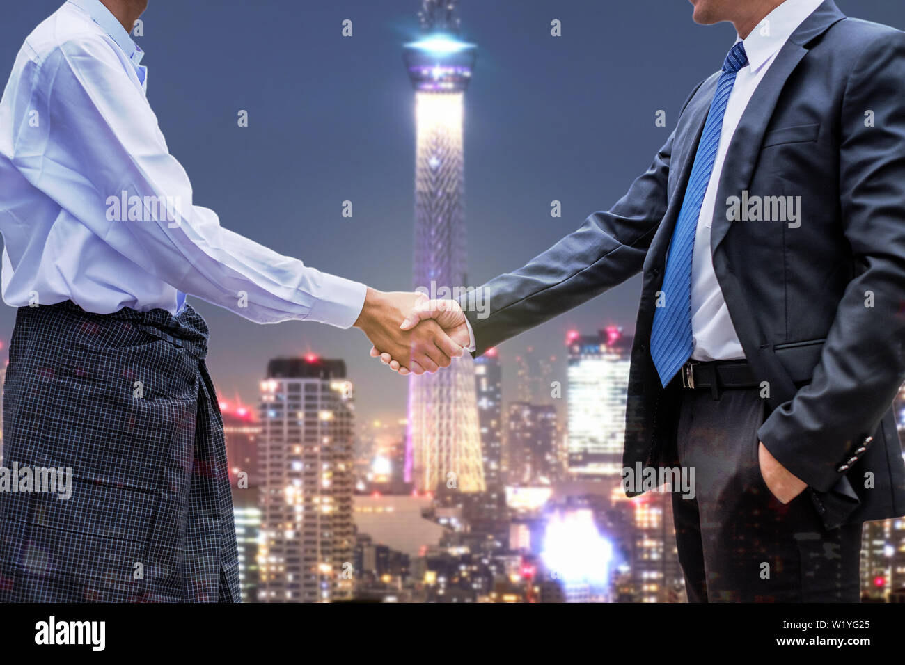 Businessman partnership handshake of asean economic community on the ...