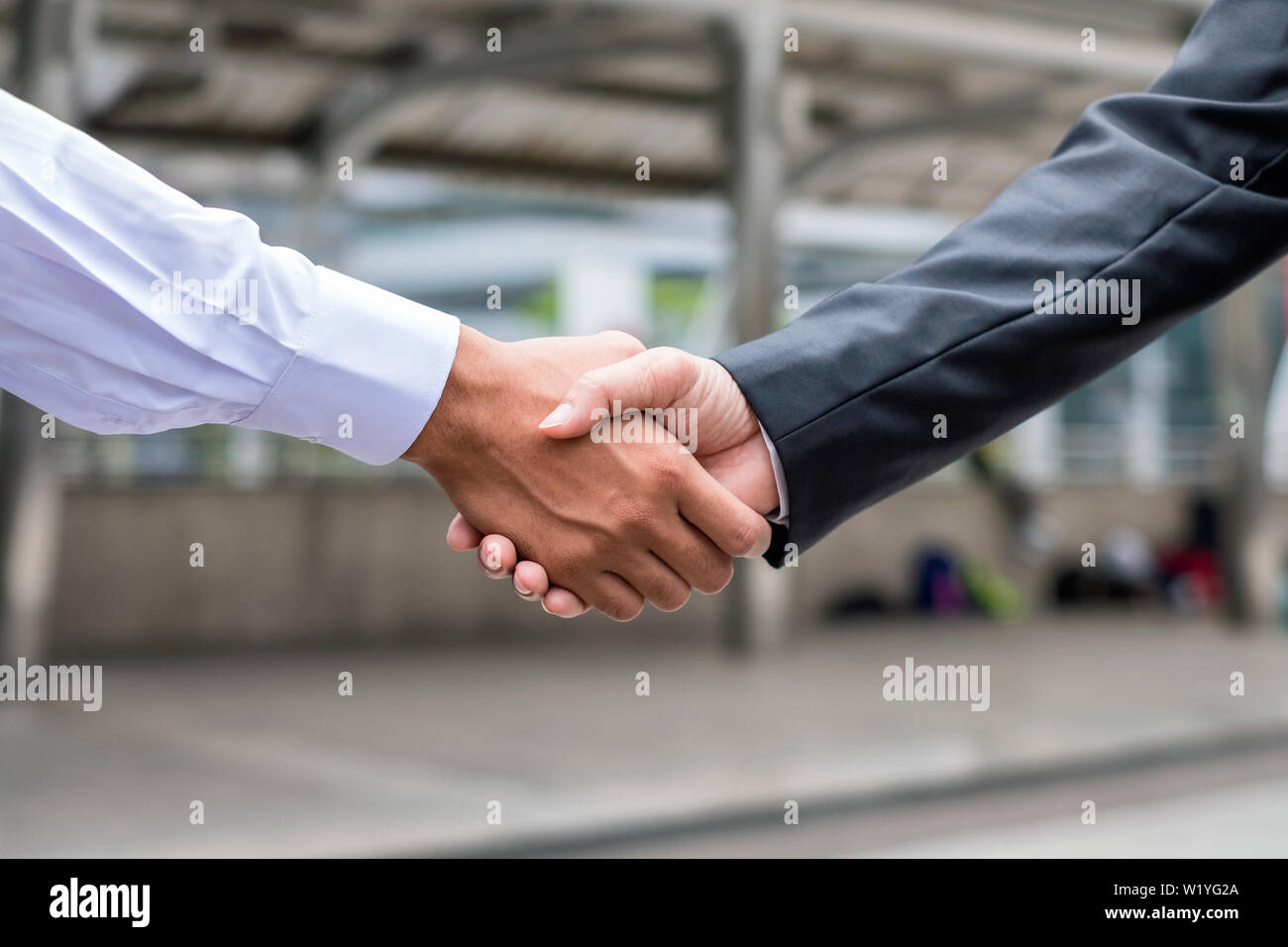 Handshake agreement of businessman with partnership in the city Stock ...