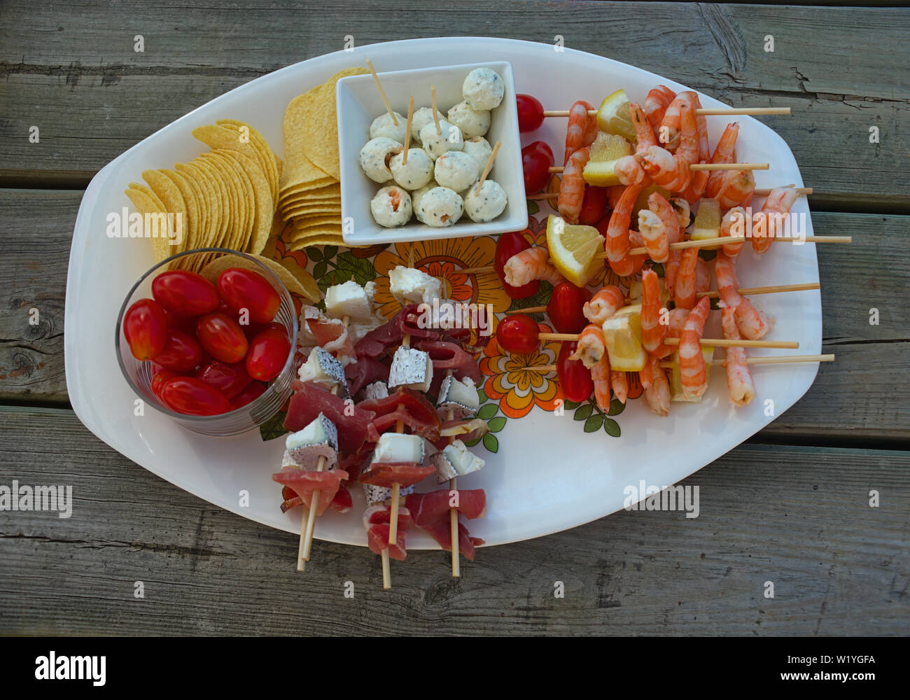 Various food prepared for appetizer on plate on wooden table Stock ...