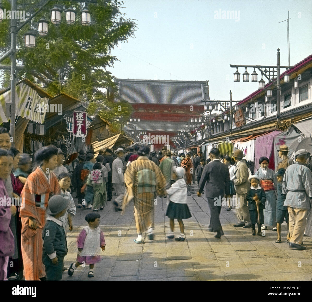 [ 1930s Japan - Shops at Asakusa, Tokyo ] — A crowd walks past the ...