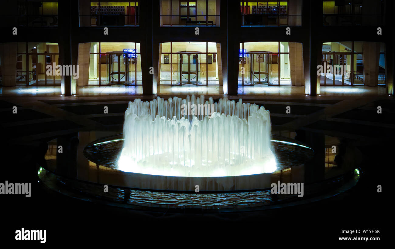 Water fountain that's lit up during the night Stock Photo - Alamy