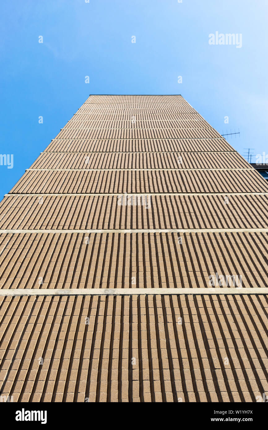 Looking up the side of a tall, windowless building, in Manhattan, NYC ...