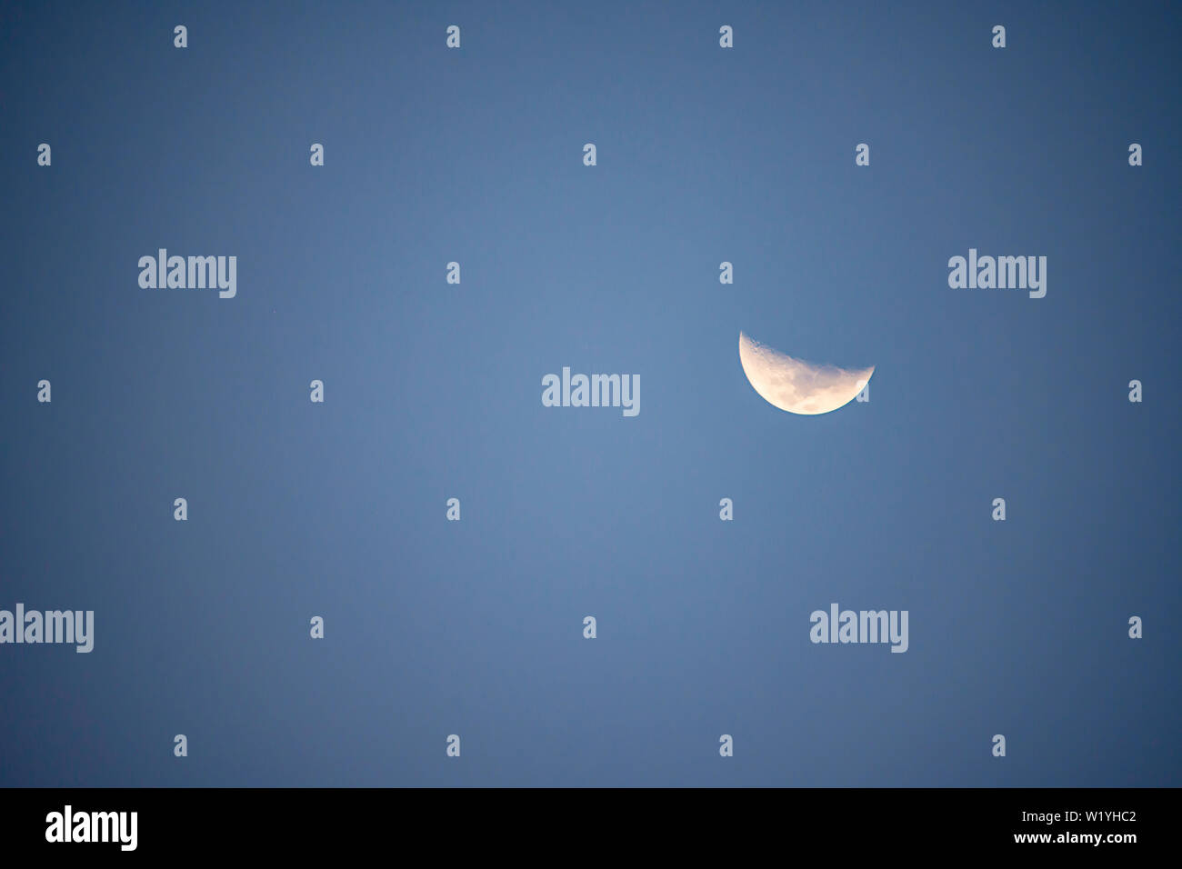 Moon in daylight On the bright sky Stock Photo - Alamy