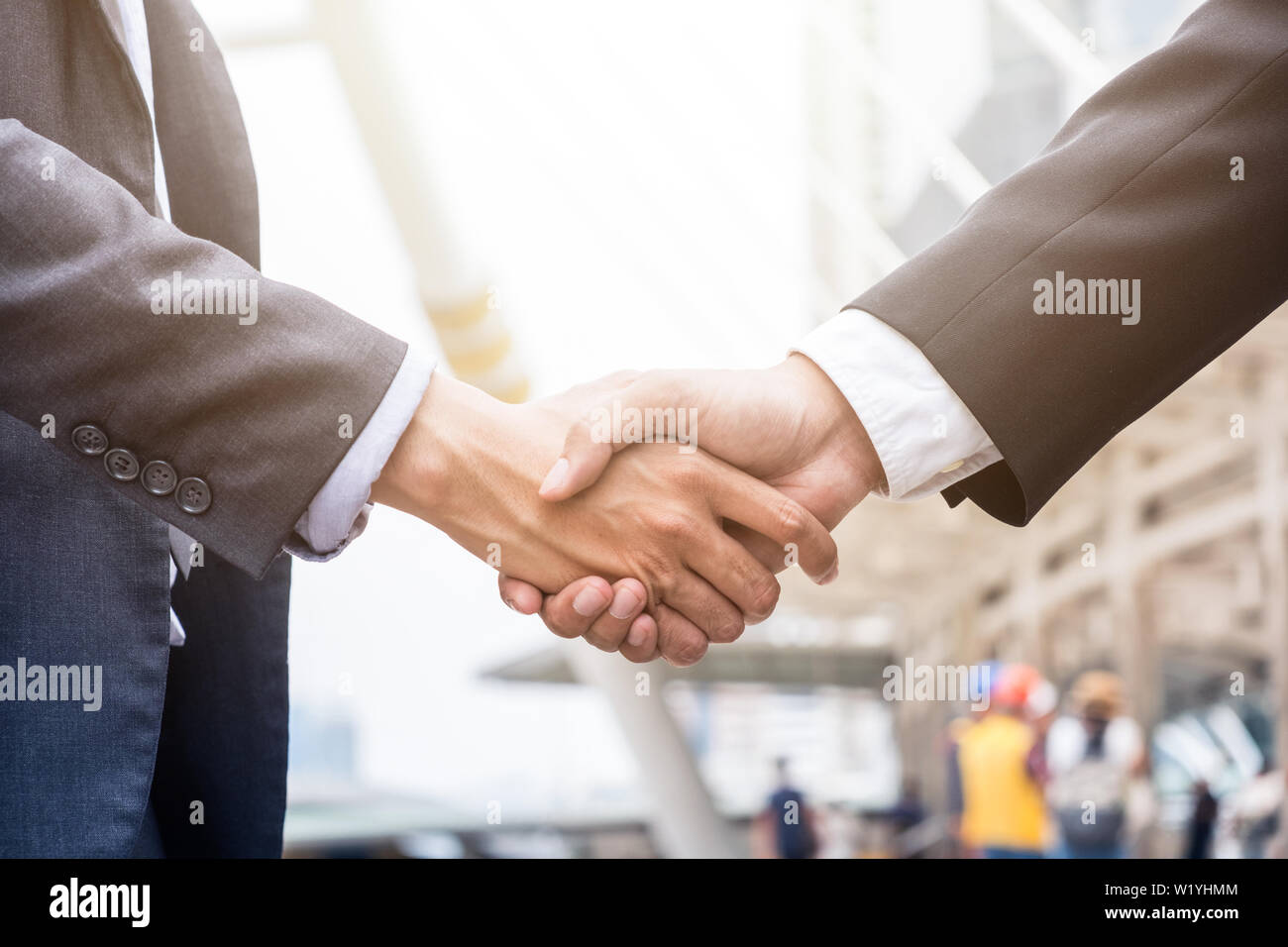 Handshake agreement of businessman with partnership in the city Stock ...