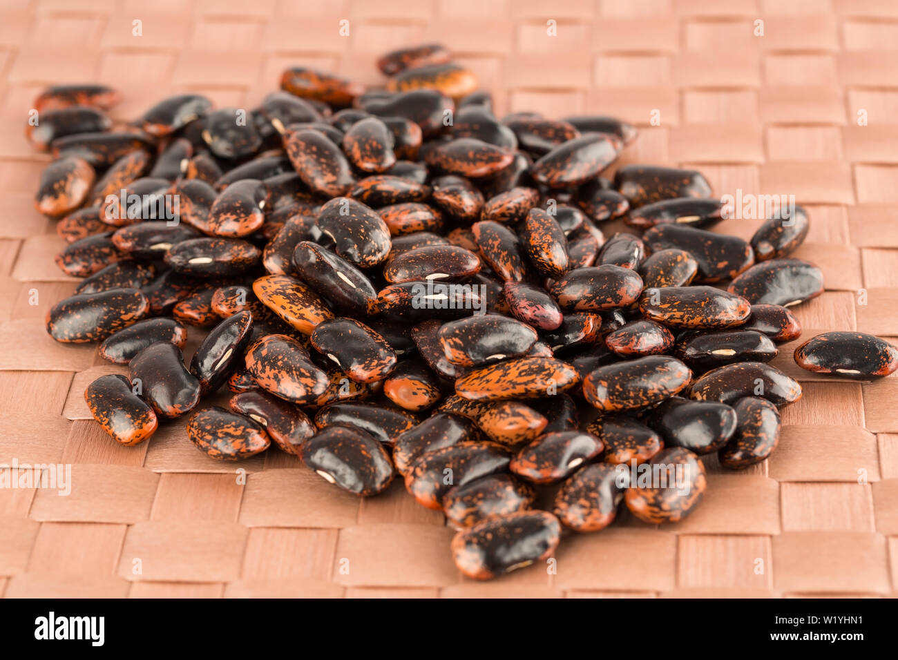 Scarlet runner beans on brown background Stock Photo - Alamy