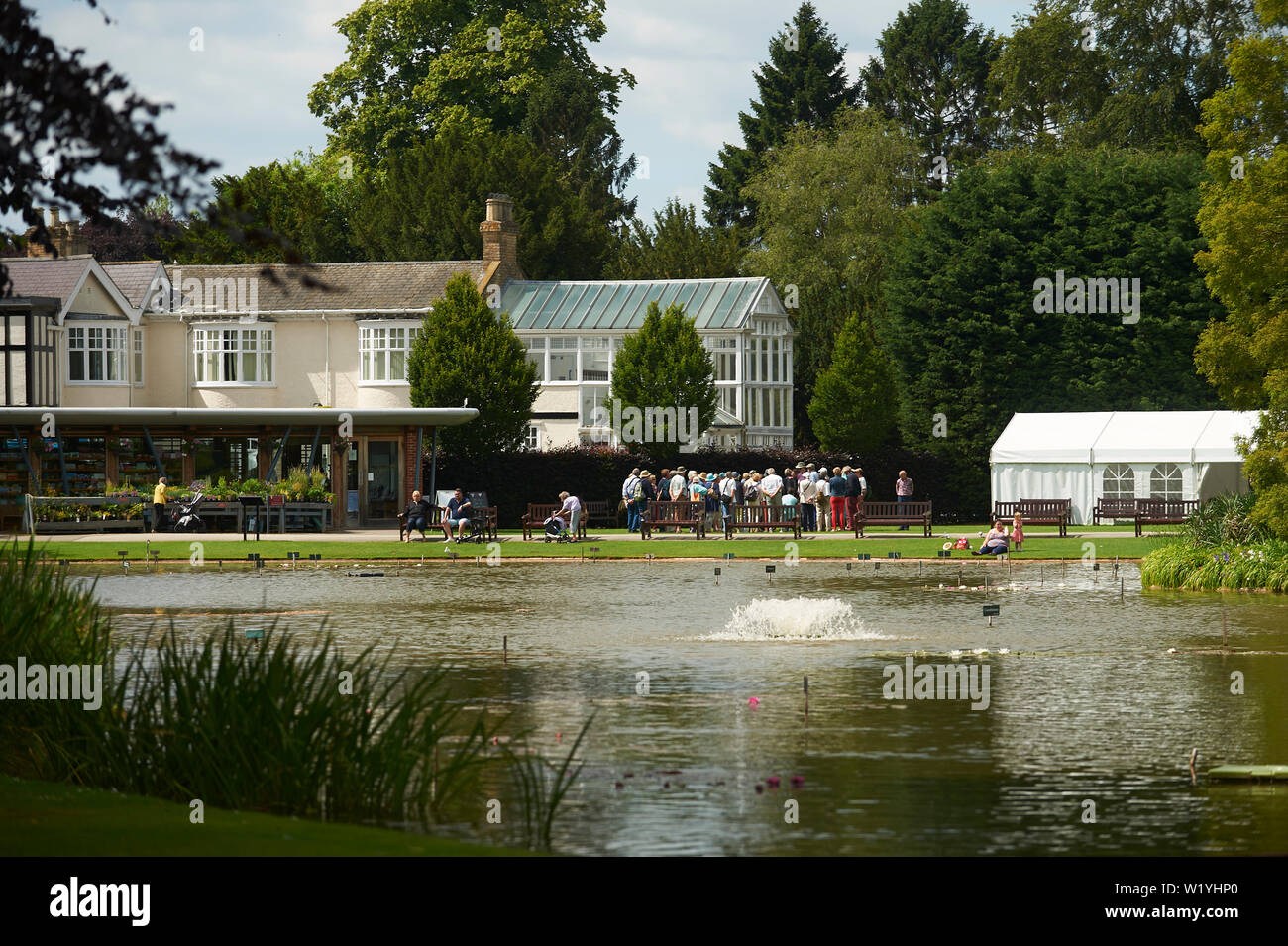 Large crowds of people at Burnby Hall Gardens, beginning a conducted ...