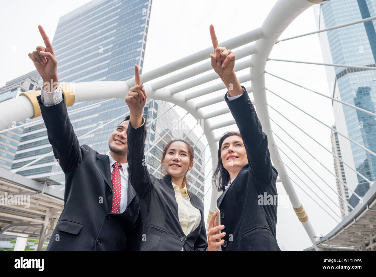 Group of leader business standing and pointing finger forward for the ...