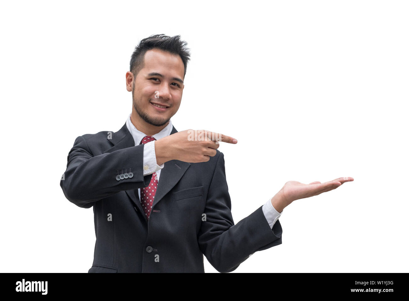 Handsome businessman smiling with hand palm showing and finger point on ...