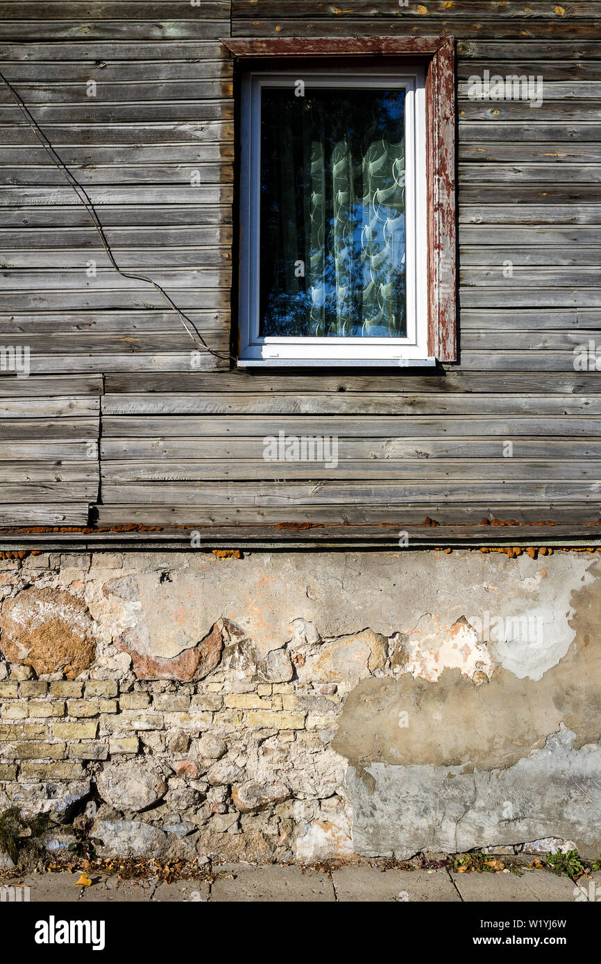 Old window on a aged wooden plank wall. Architectural detail ...