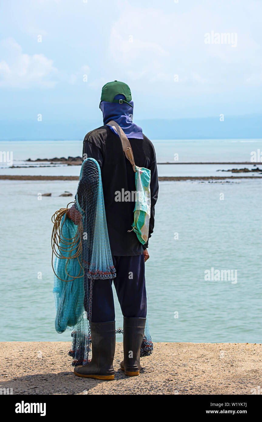 Man holding nets hi-res stock photography and images - Alamy