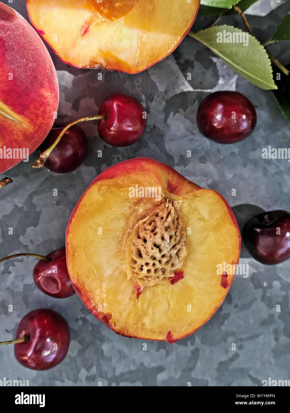 amazing view of peaches and cherries on the table. Bright, juicy fruits ...