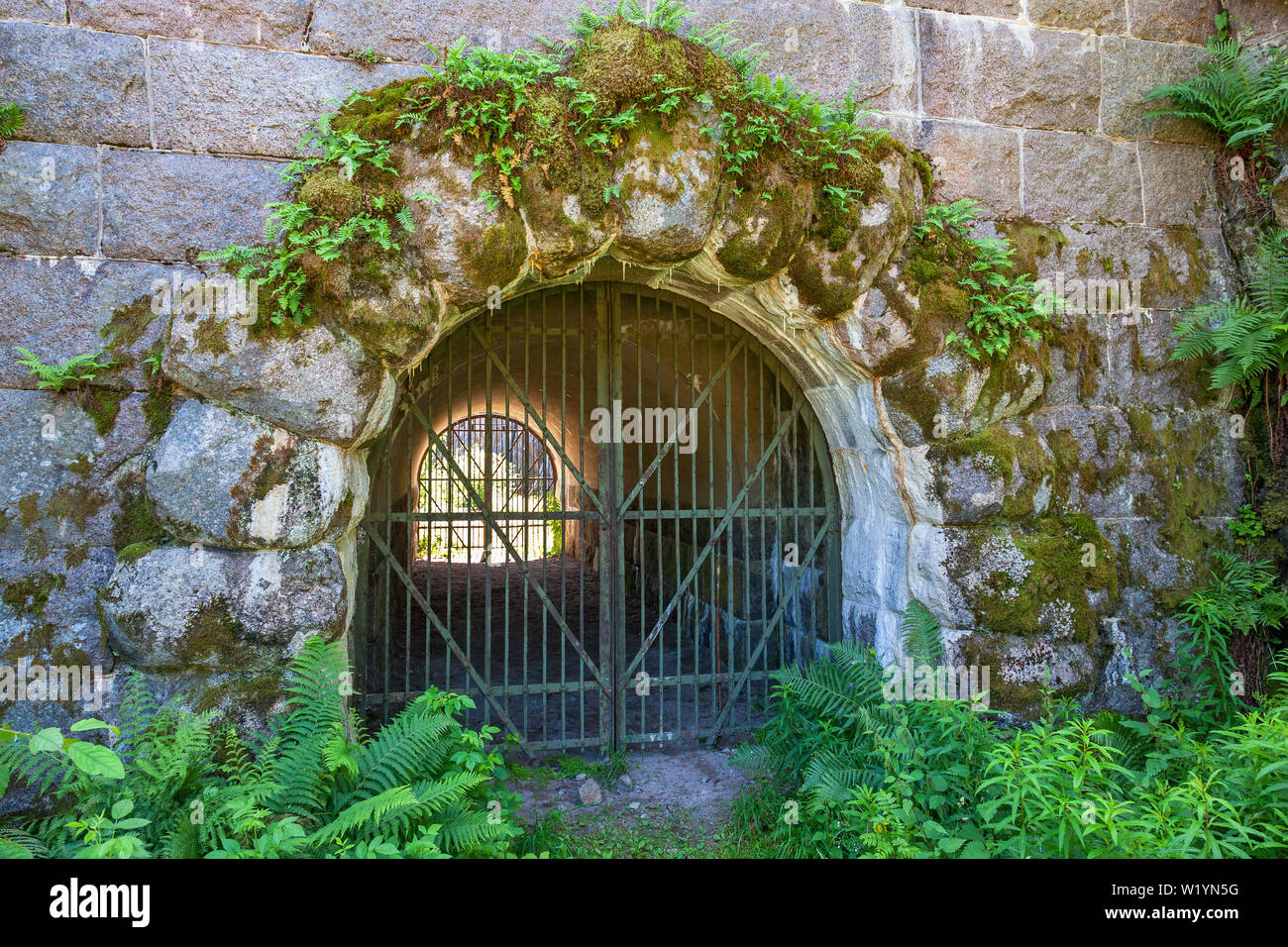 Iron gate with archway to moat into a fortress Stock Photo - Alamy