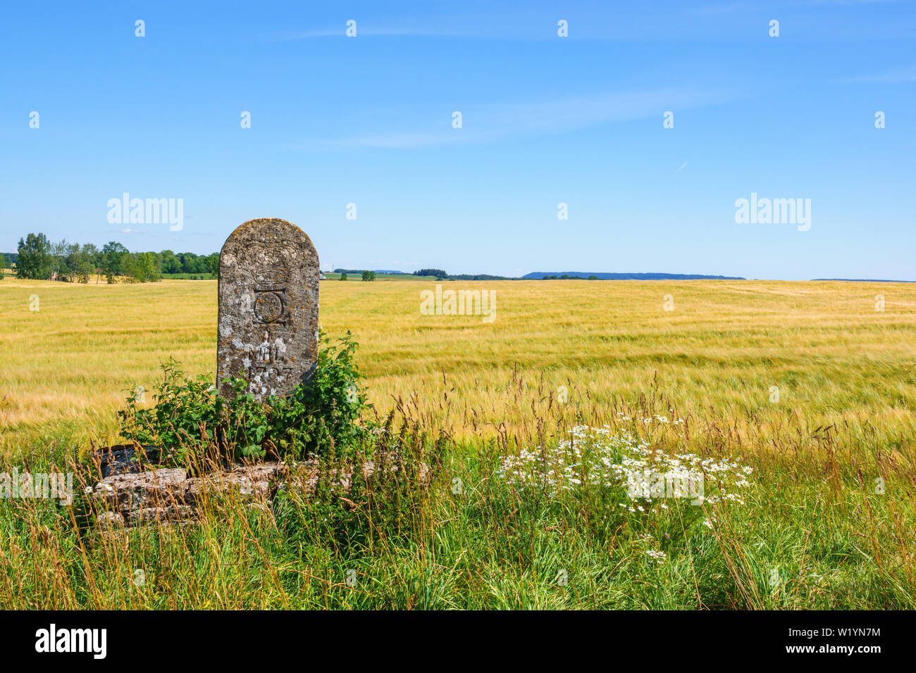 Old Milestone in a rural landscape Stock Photo - Alamy
