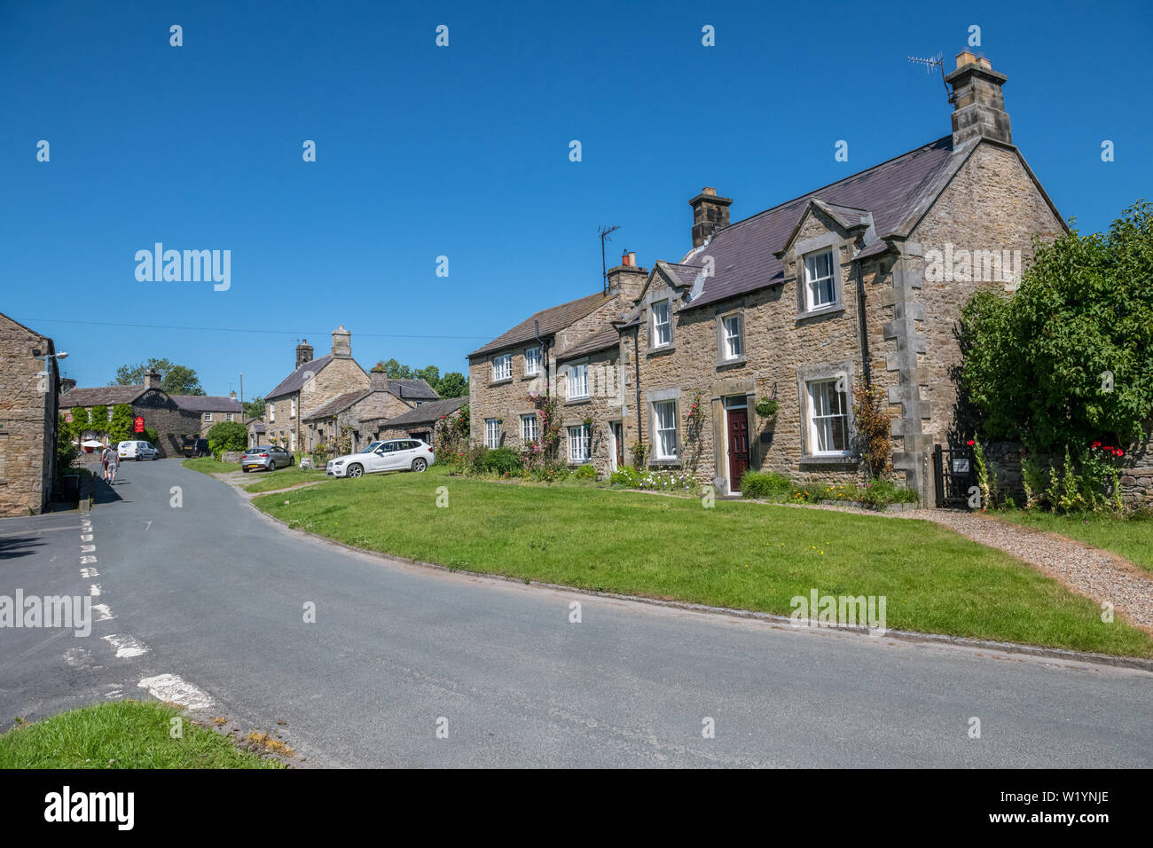 Local stone built housing in the Yorkshire Dales village of Redmire ...