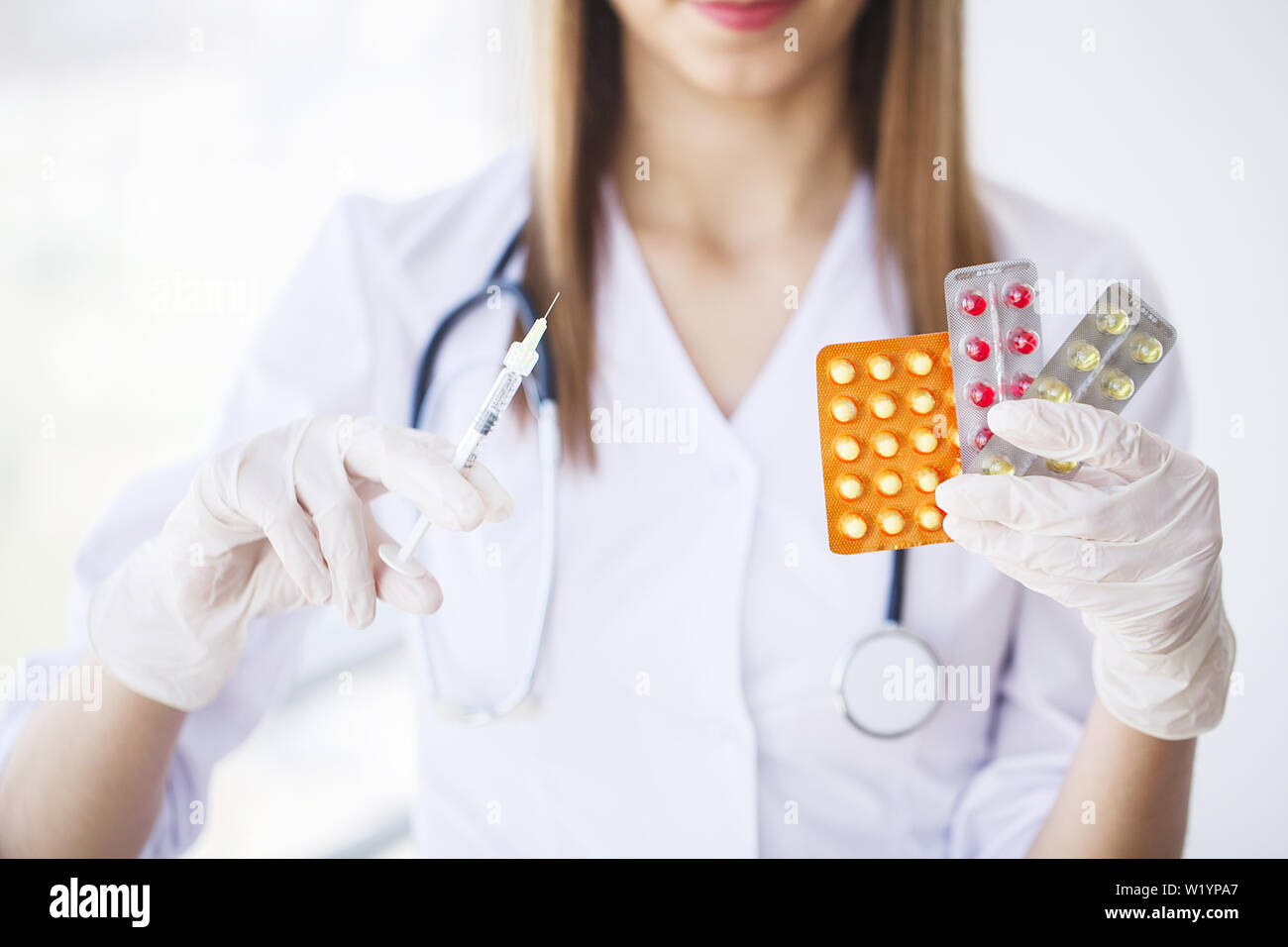 Clinic. Portrait of young doctor standing in medical office Stock Photo ...