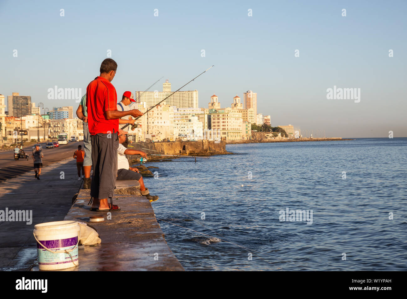 Havana, Cuba - May 21, 2019: Cuban people are fishing in the ocean ...