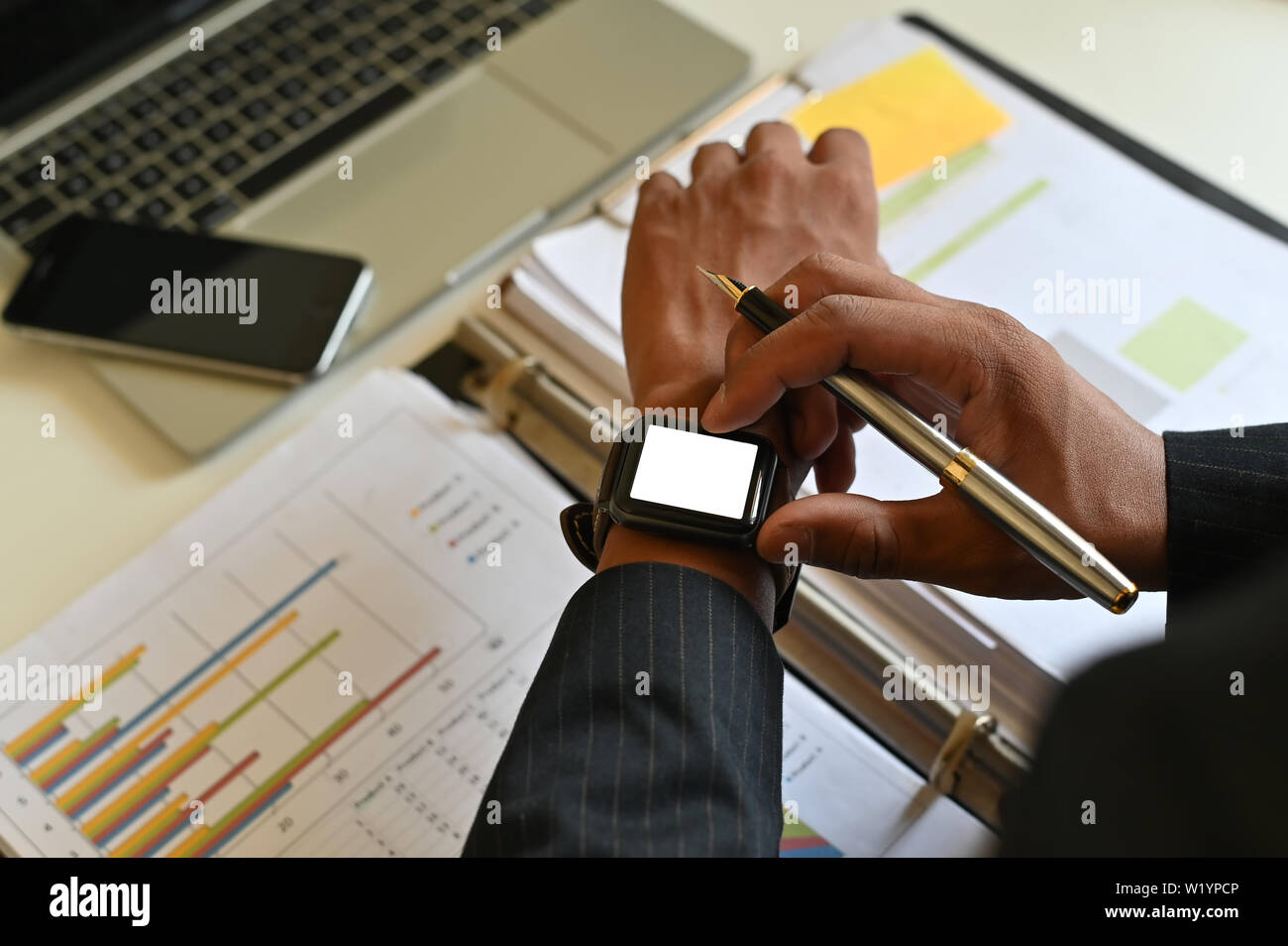 Man using smartwatch desk hi-res stock photography and images - Alamy