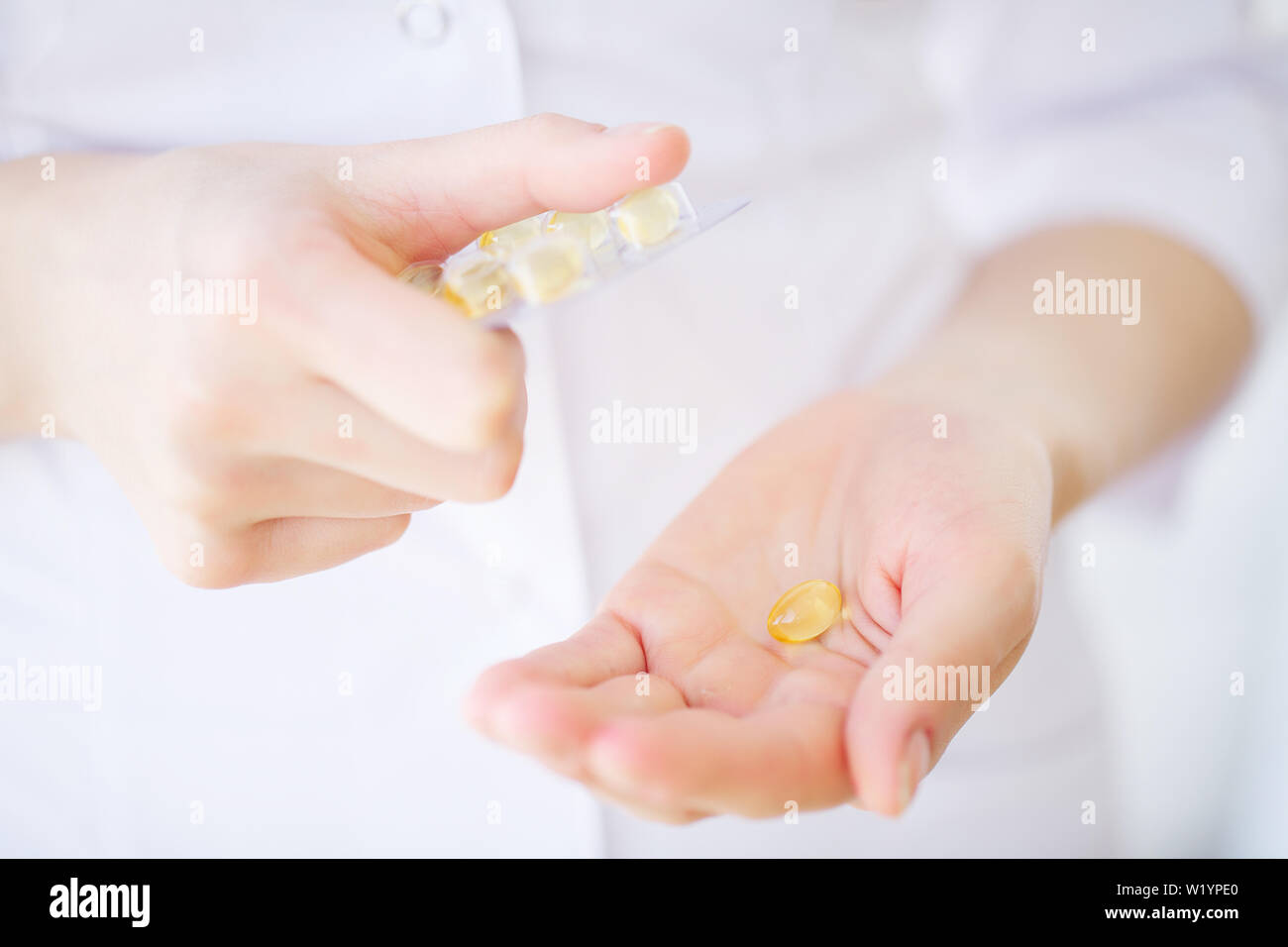 Medicine herb. Herbal pills in hand, palm, fingers with healthy medical ...