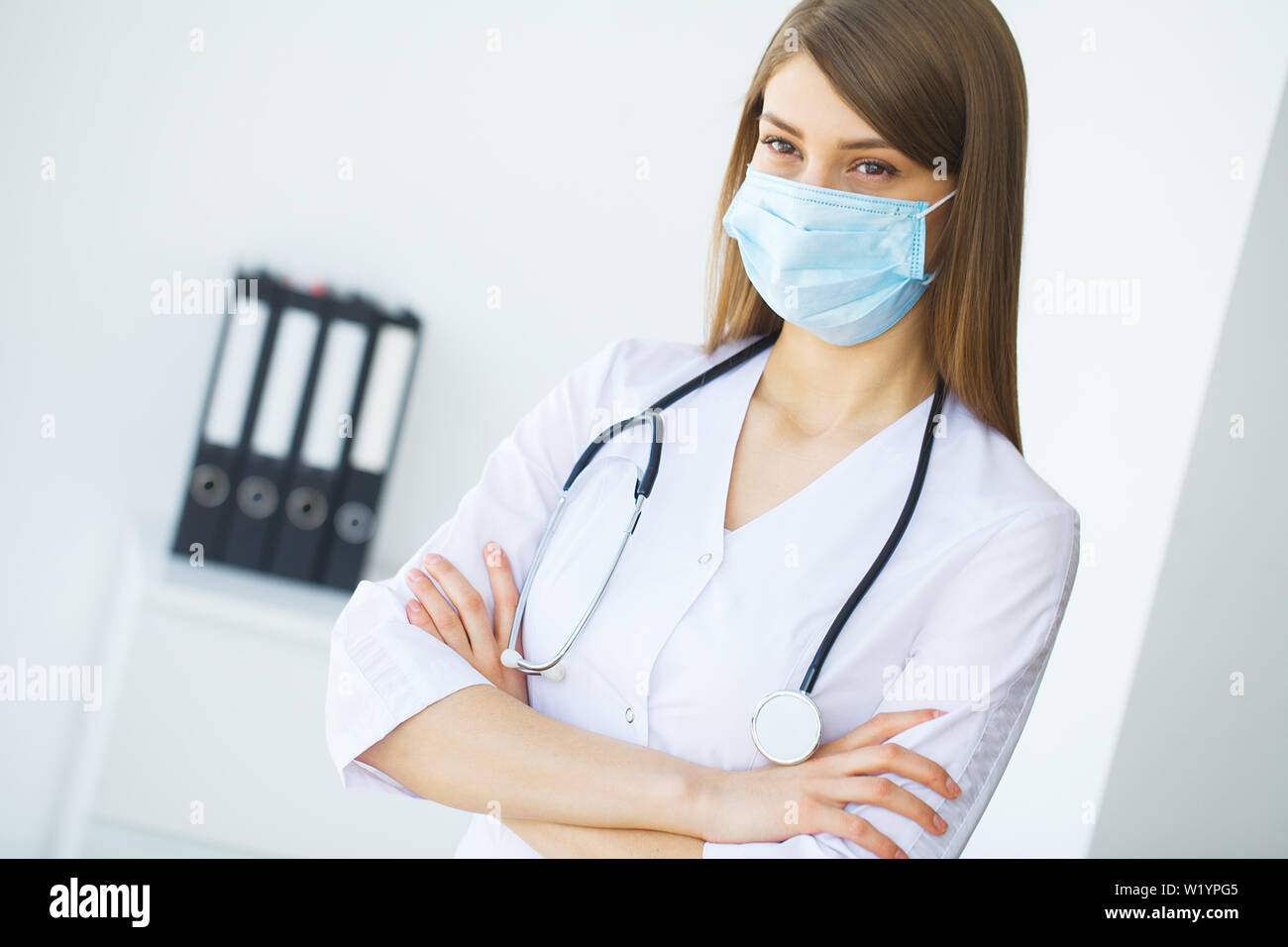 Clinic. Portrait of young doctor standing in medical office Stock Photo ...