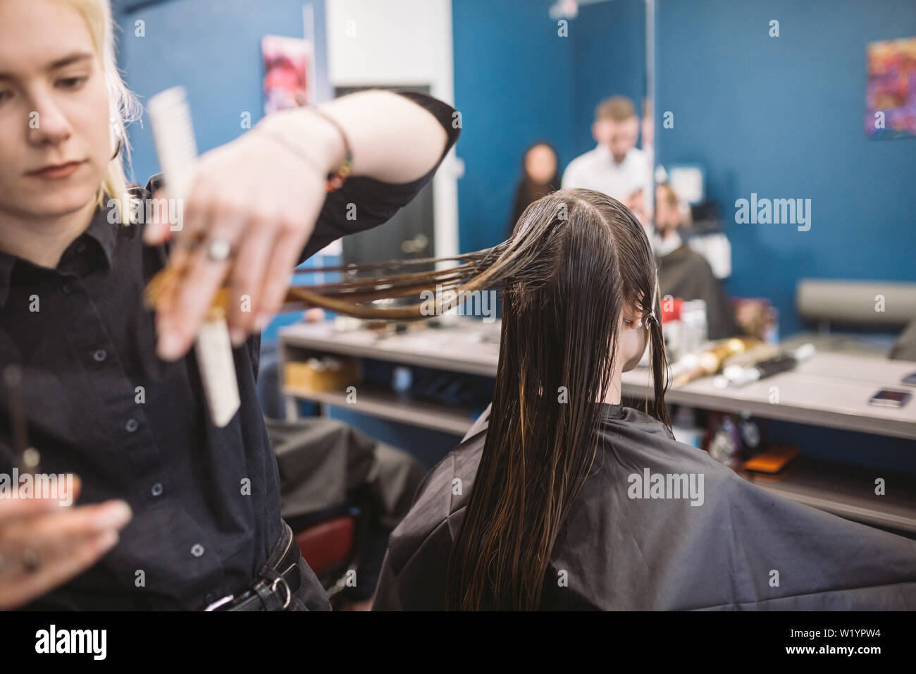 Haircutting in process hi-res stock photography and images - Alamy