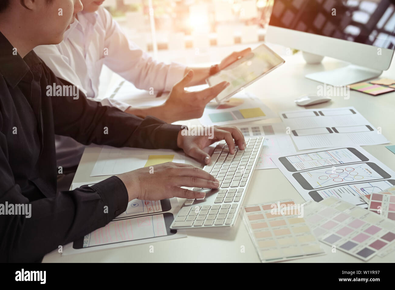 Software developer ux designer designing designers smartphone layout ...