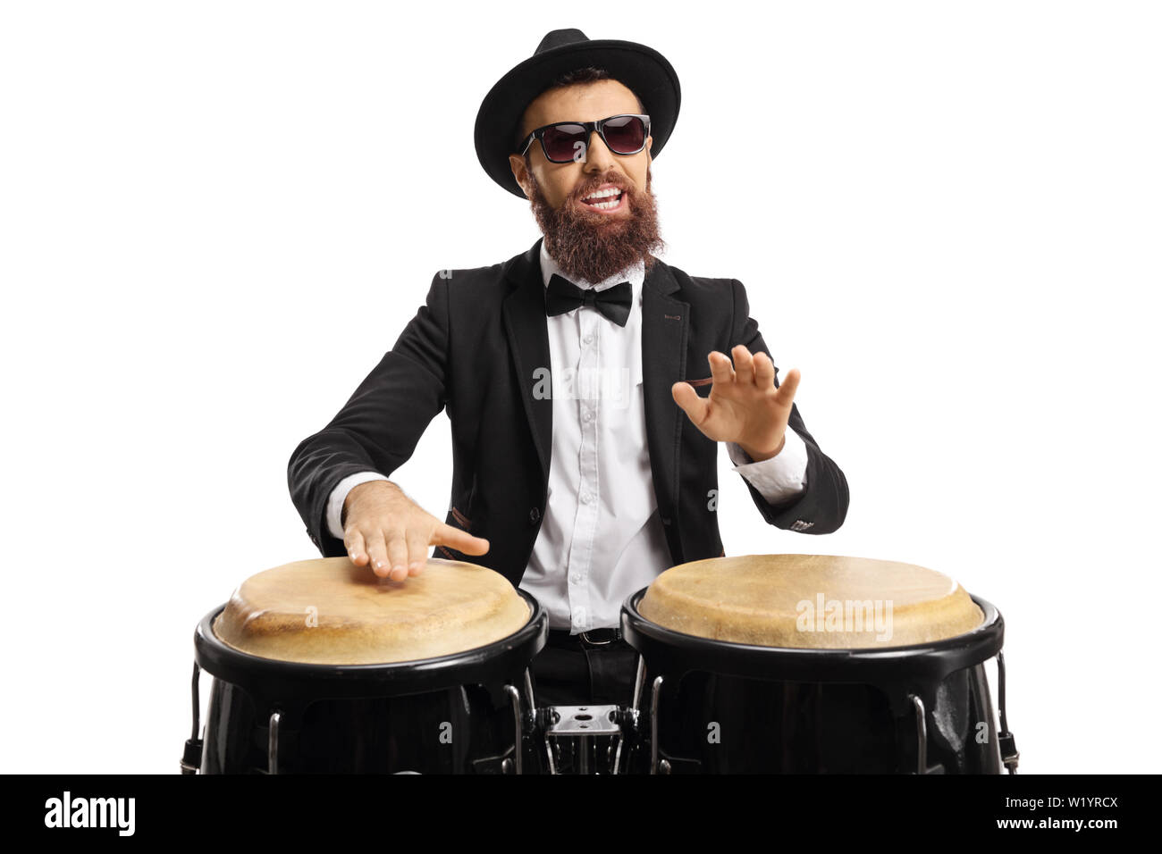 Portrait of a man in a suit playing conga drums isolated on white ...