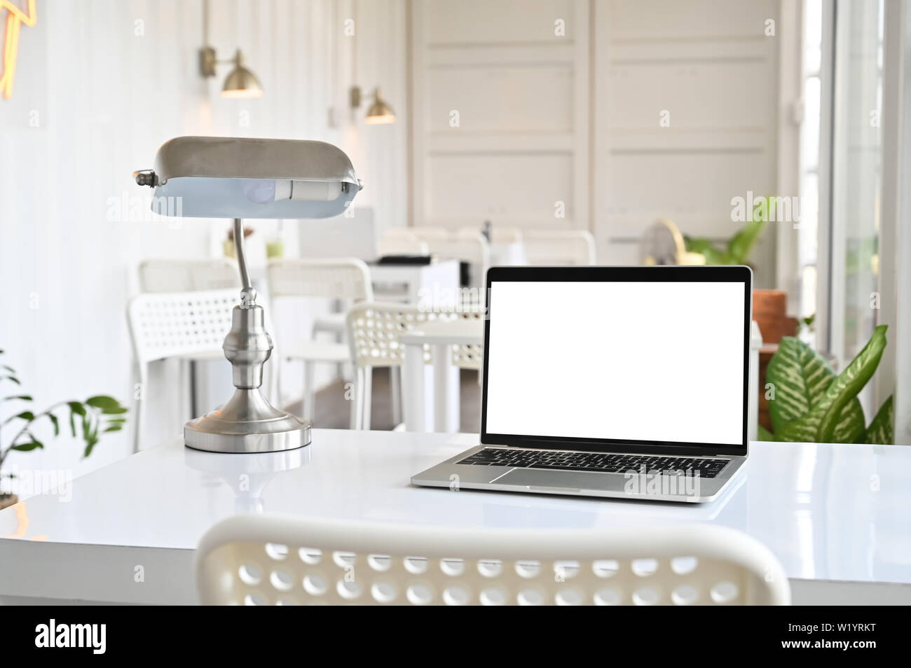 Workspace with Computer laptop and lamp on office table with montage ...