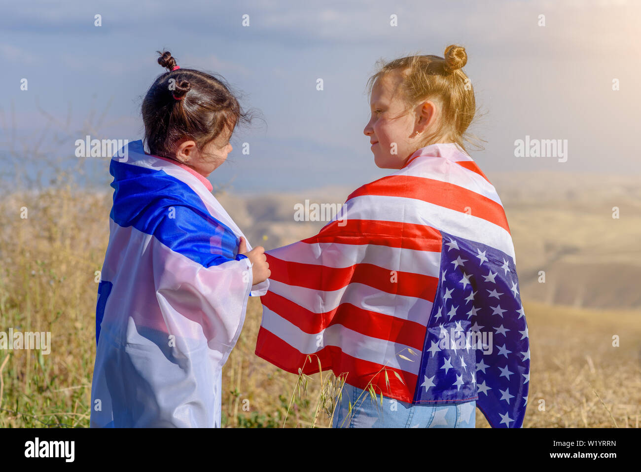 Two cute girls with American and Israeli flags.Two nations one heart ...