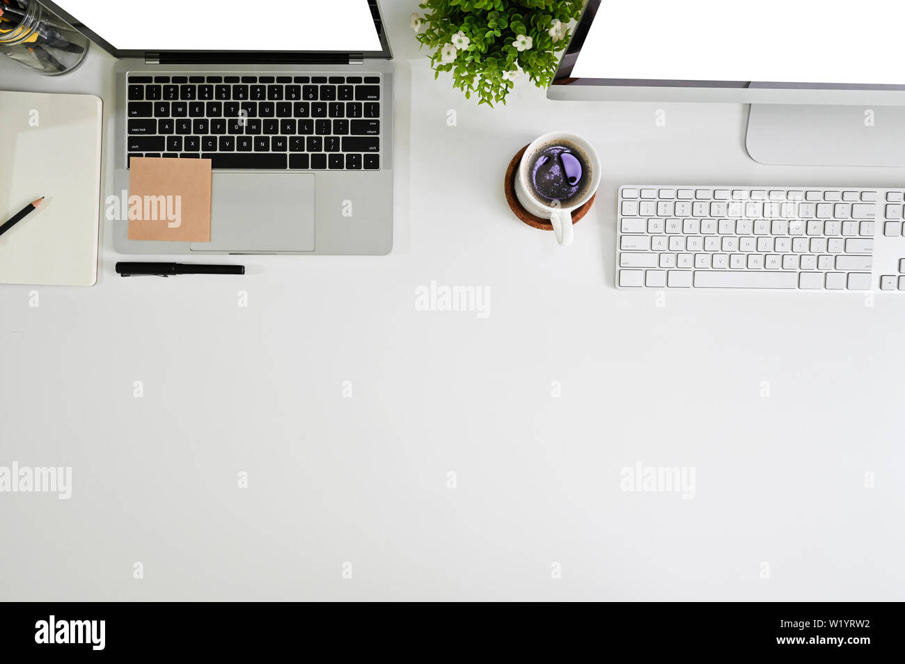 Above office desk with Computer PC and Laptop computer with office ...